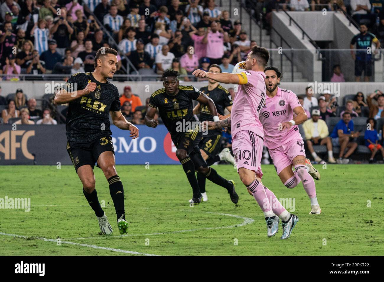 Inter Miami forward Lionel Messi (10) is defended by LAFC defender Aaron Long (33) after ...