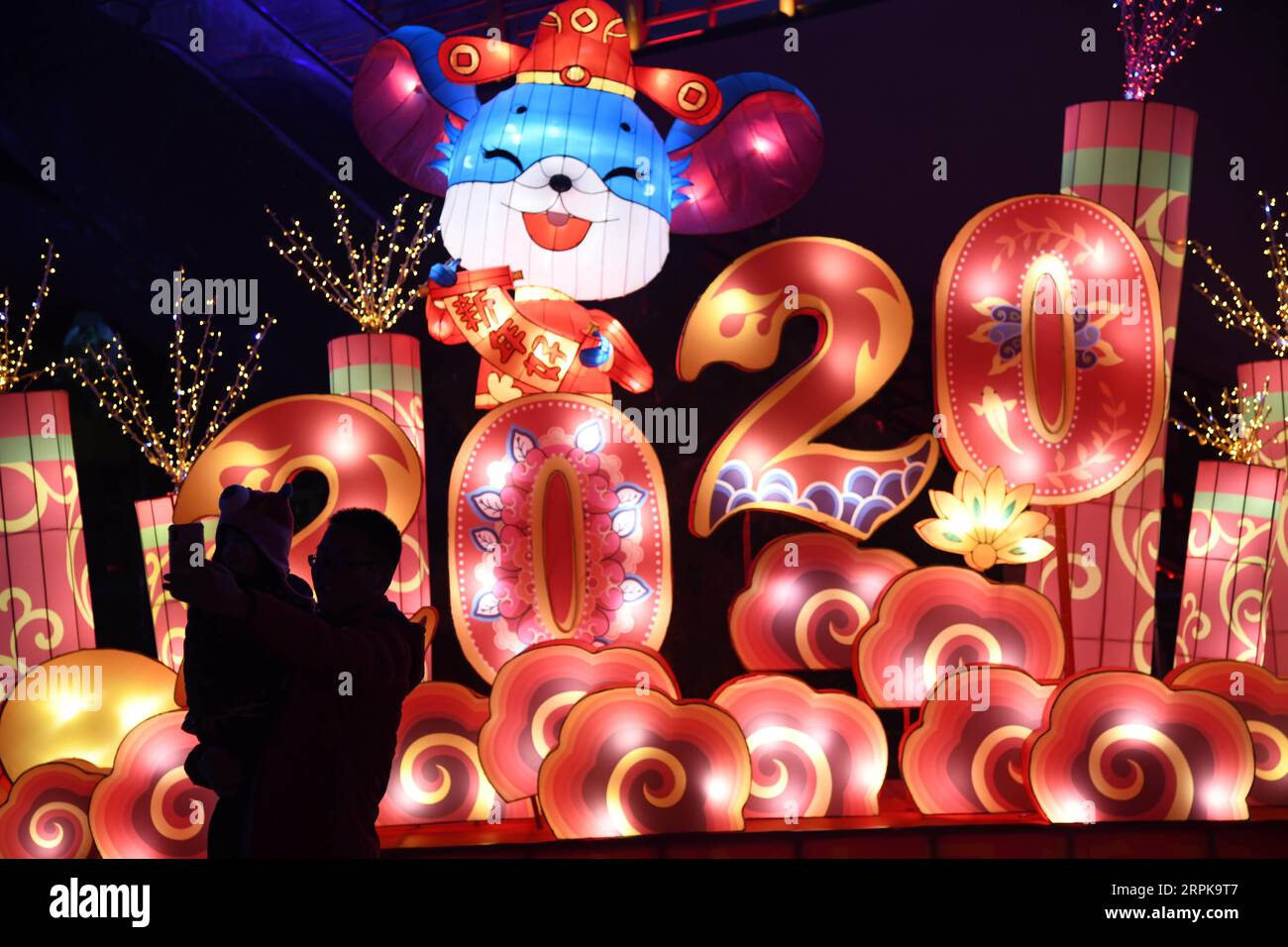 200104 -- LINYI, Jan. 4, 2020 -- People visit a light installation art ...
