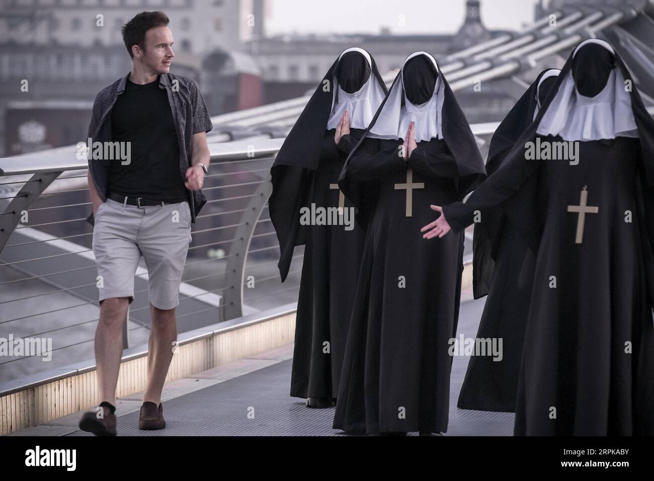 London, UK. 5th September 2023. A bemused local walks past seven ...