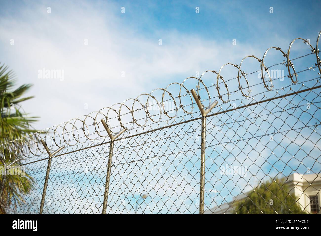 Prisoner behind prison fence hi-res stock photography and images - Alamy
