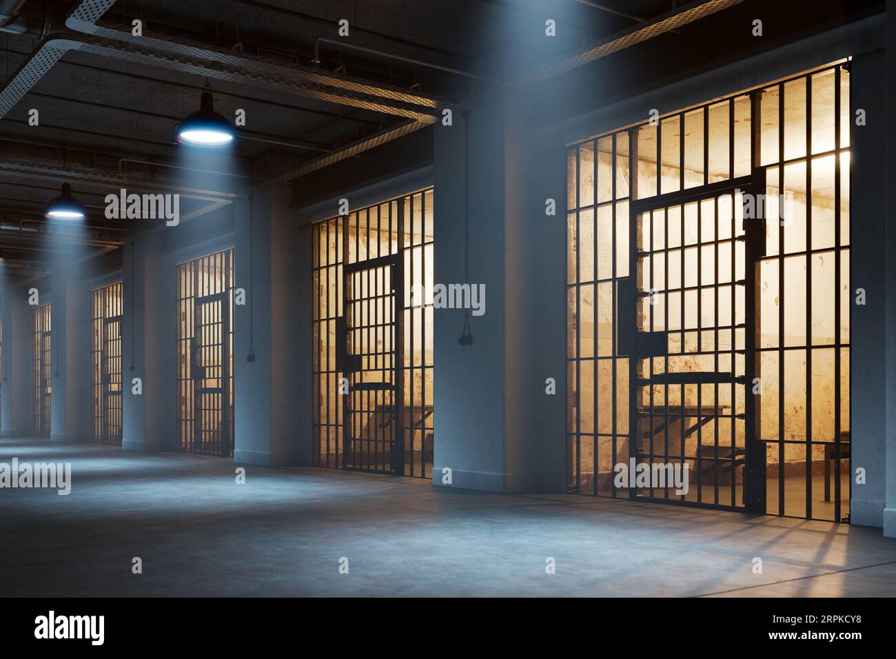 A gloomy jail corridor lit by yellow light shining from prisoner's ...