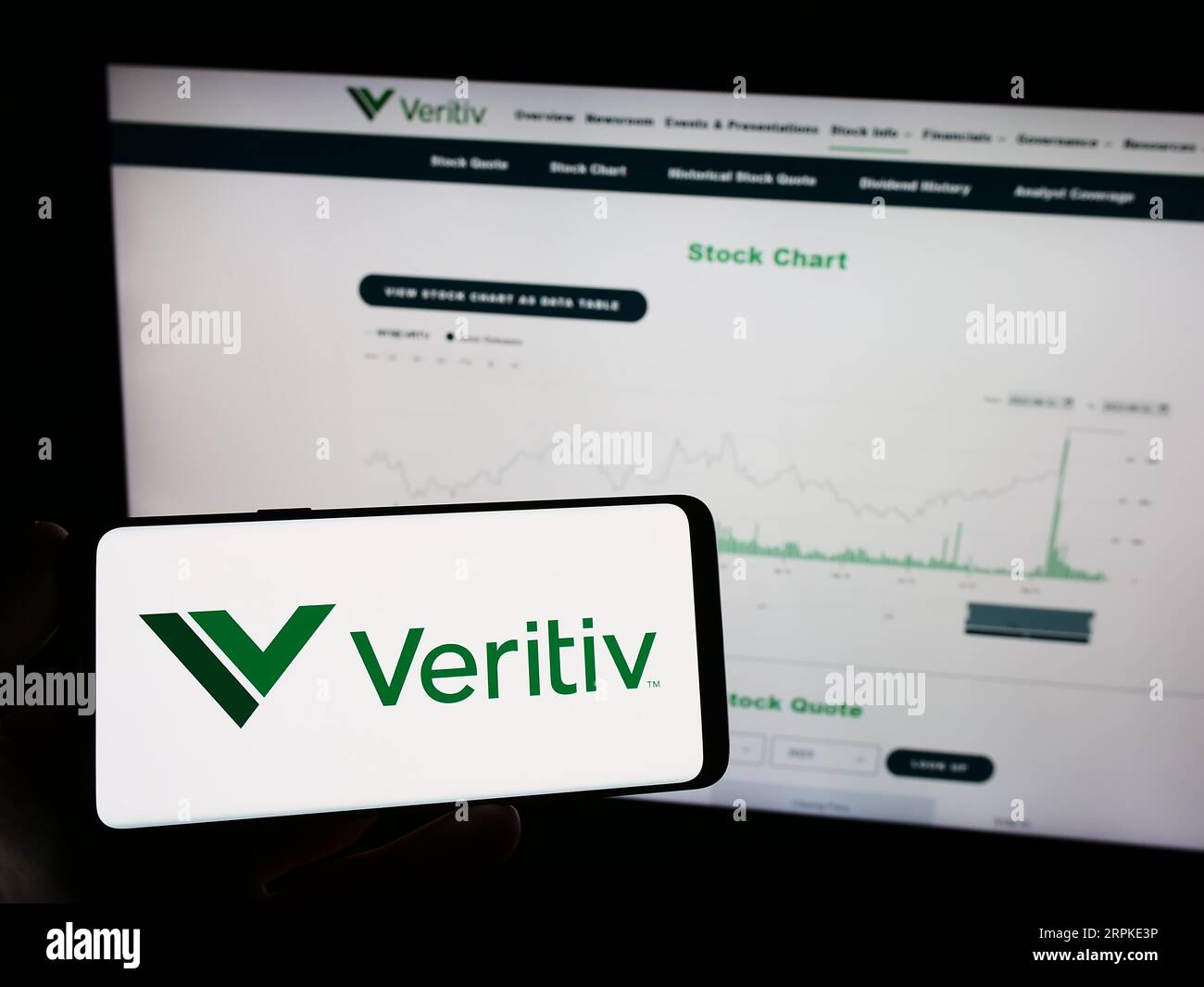 Person holding mobile phone with logo of American packaging company ...