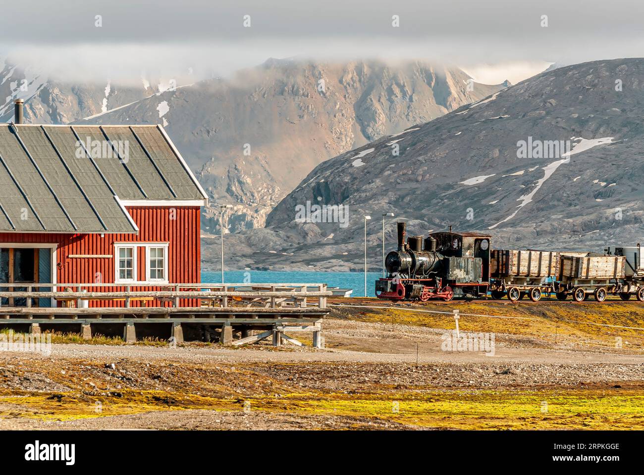 House and abandoned coal train in the Village Ny Alesund in Svalbard ...