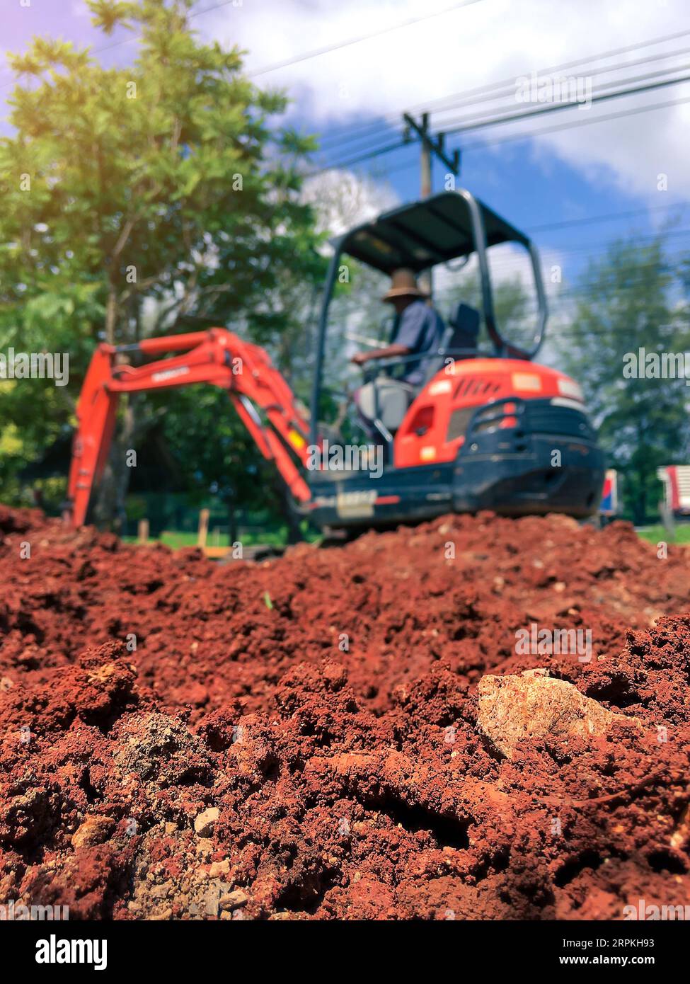 Soil close up blurred backhoe to renovate the site in preparation for ...