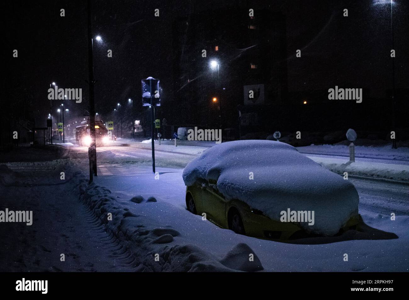 Frosty Evening in Cityscape: Icy Streets and Illuminated Lights Stock ...