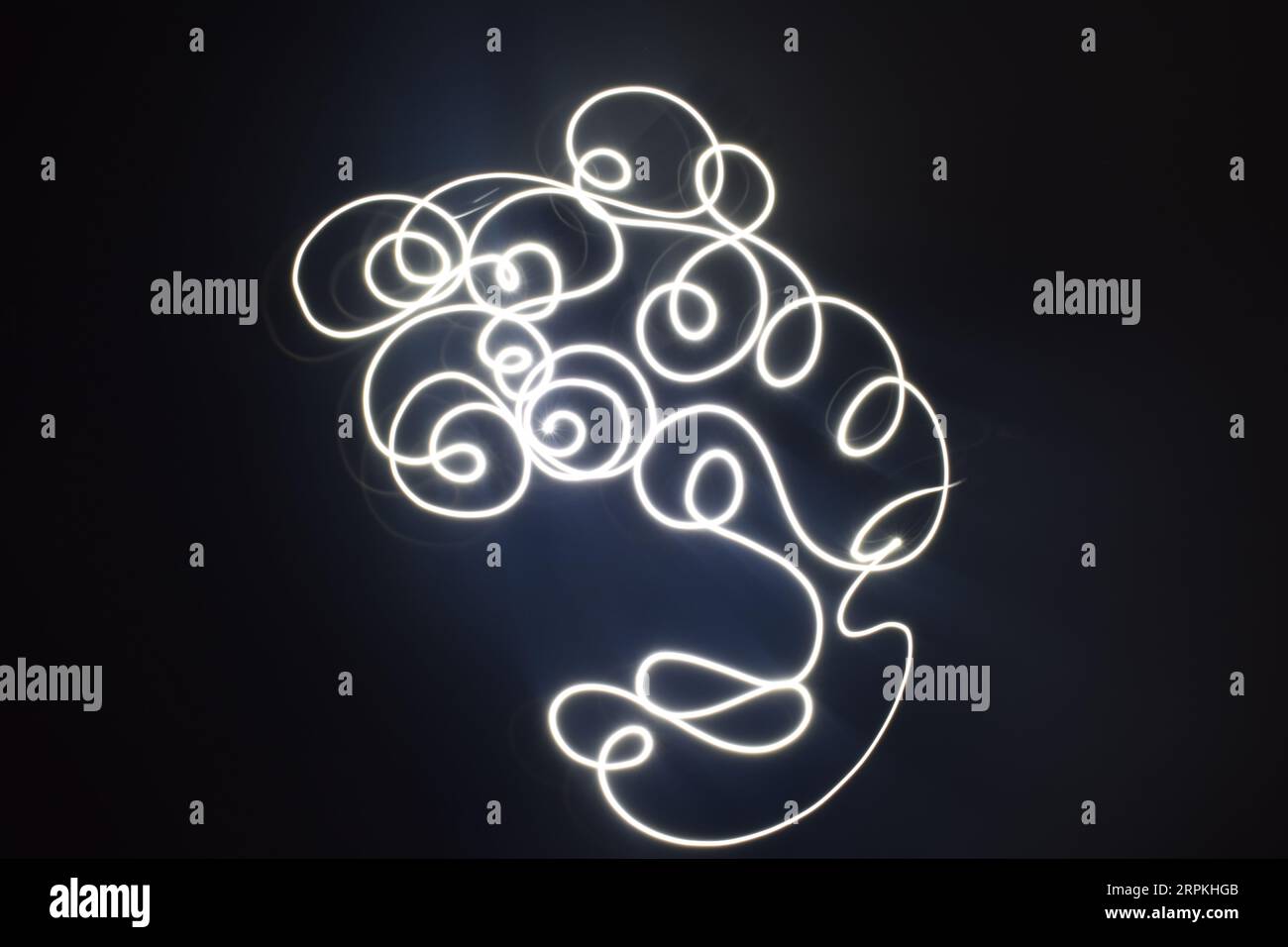 Neon Script Sign light drawing on Black Background Stock Photo - Alamy