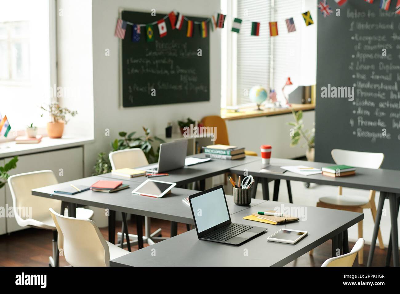 Modern empty classroom with computers on table at school Stock Photo ...