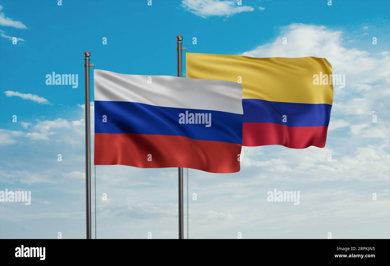 Colombia and Russia flag waving together in the wind on blue sky, two ...