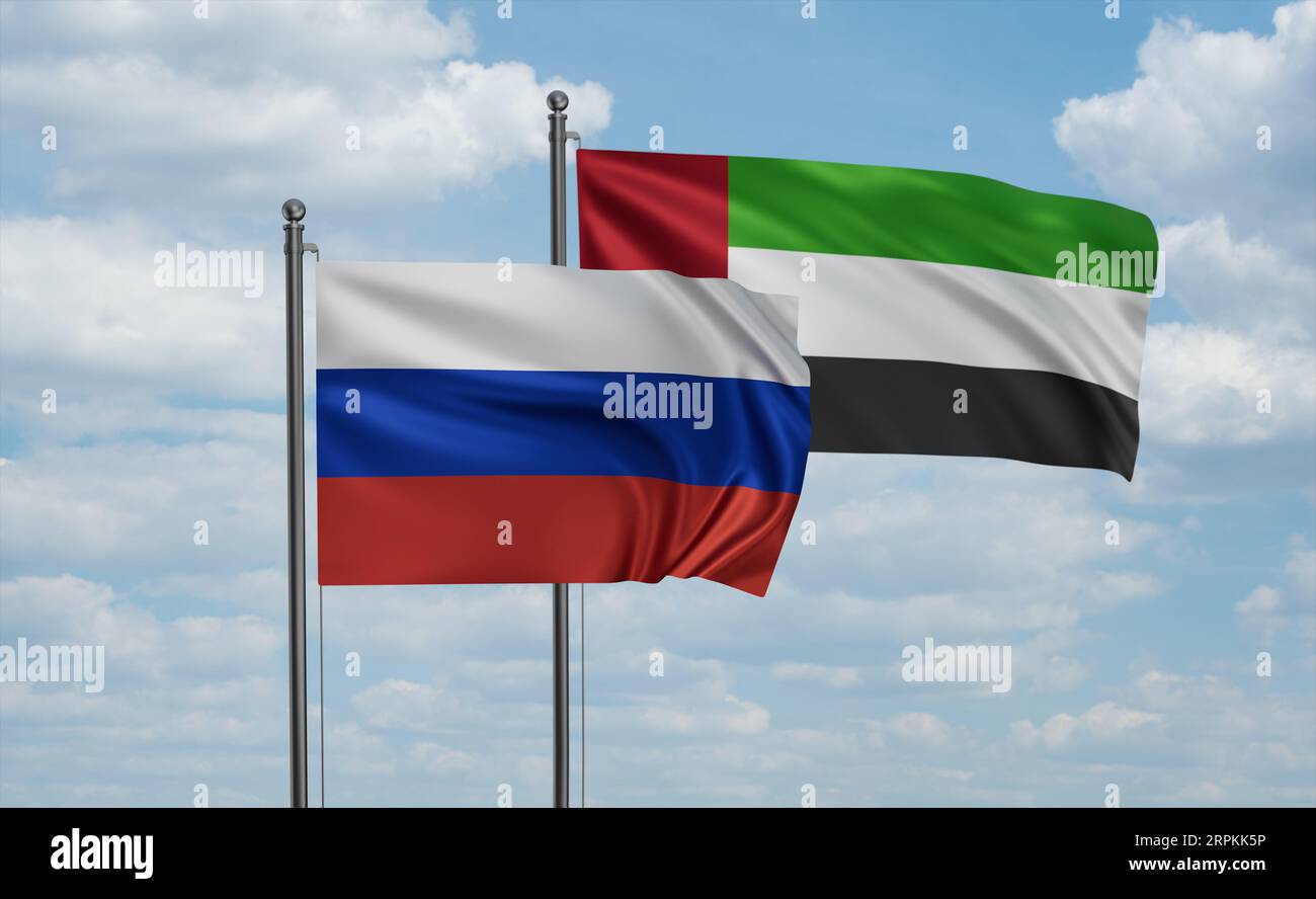 United Arab Emirates and Russia flag waving together in the wind on ...