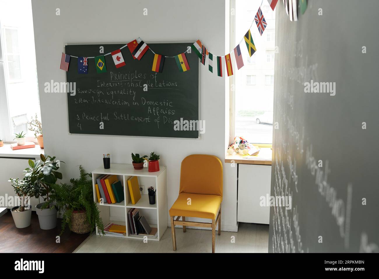 Modern empty classroom with blackboard and flags at school Stock Photo ...