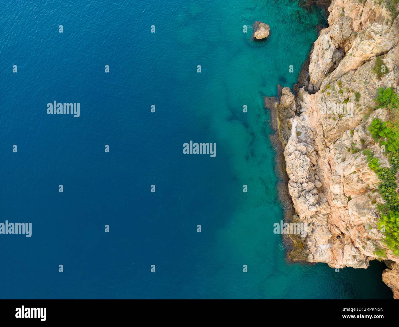 Aerial bird's eye view of cliffs and turquoise sea in Antalya Turkey ...