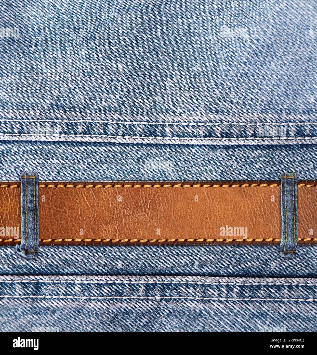 Blue denim background with leather belt. Horizontal or vertical ...