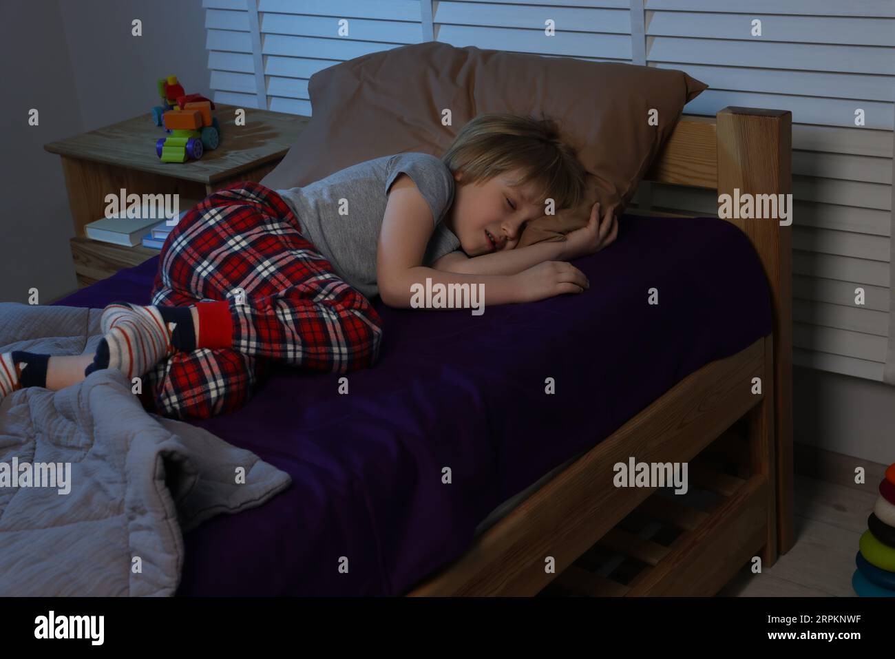 Little boy snoring while sleeping on bed at night Stock Photo - Alamy