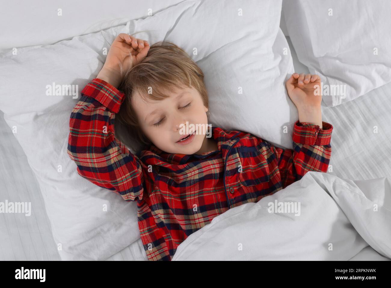 Little boy snoring while sleeping in bed, top view Stock Photo - Alamy