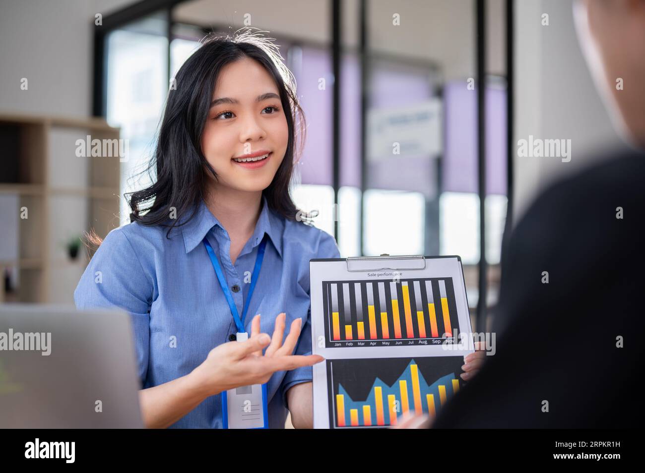 A beautiful and professional Asian businesswoman or female sales ...