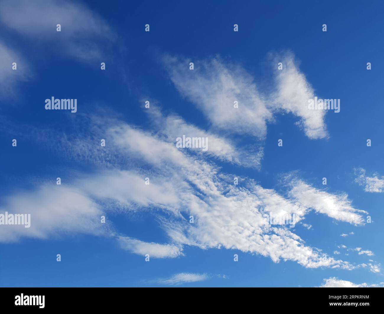 Wispy clouds drift across hi-res stock photography and images - Alamy