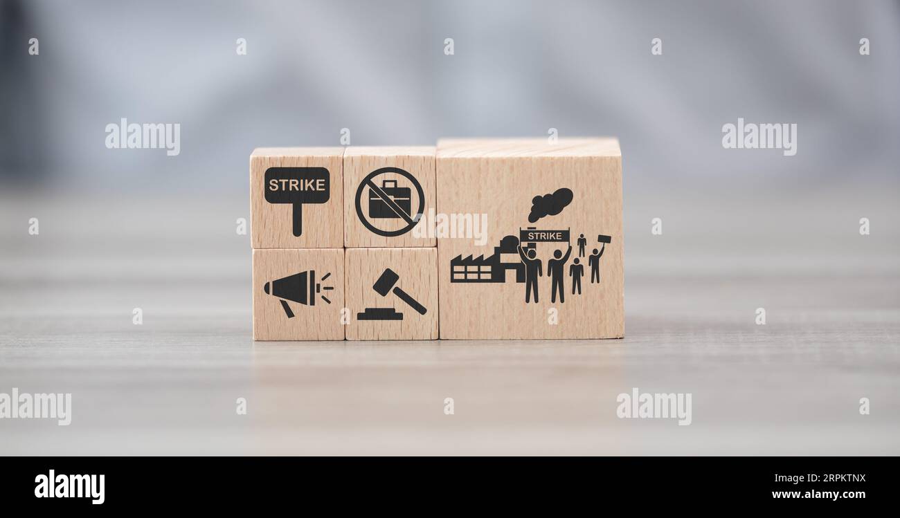 Wooden blocks with symbol of strike concept Stock Photo - Alamy