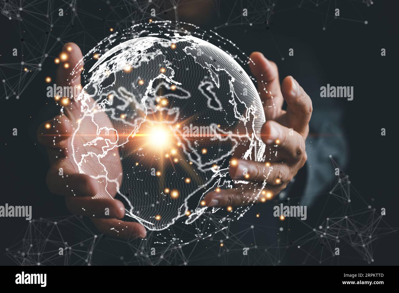 A businessman's hand holds a globe, illustrating seamless connectivity ...