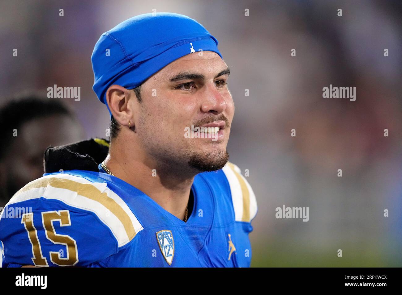 UCLA defensive lineman Laiatu Latu stands on the sideline during the ...