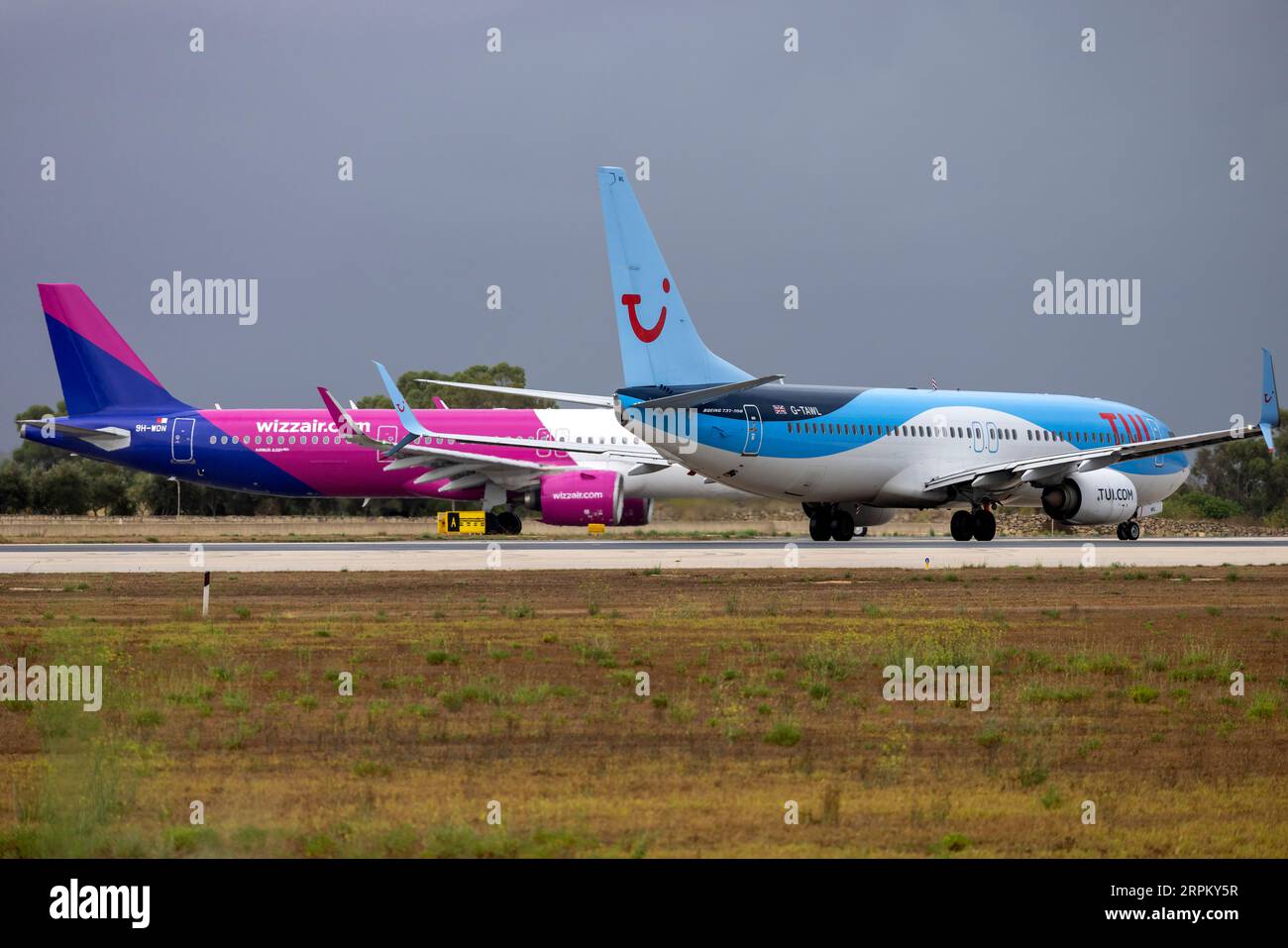 TUI Airways Boeing 737-8K5 (REG: G-TAWL) taking off after a shower ...