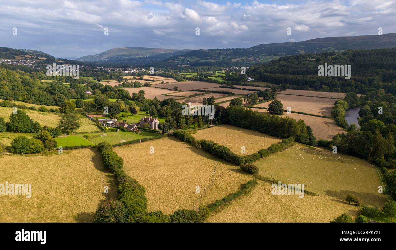 An aerial view of the Welsh countryside with mountains in the distance ...