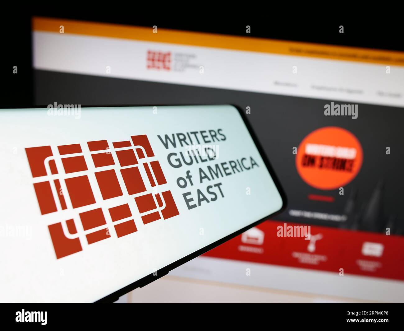 Smartphone with logo of labor union Writers Guild of America East (WGAE ...