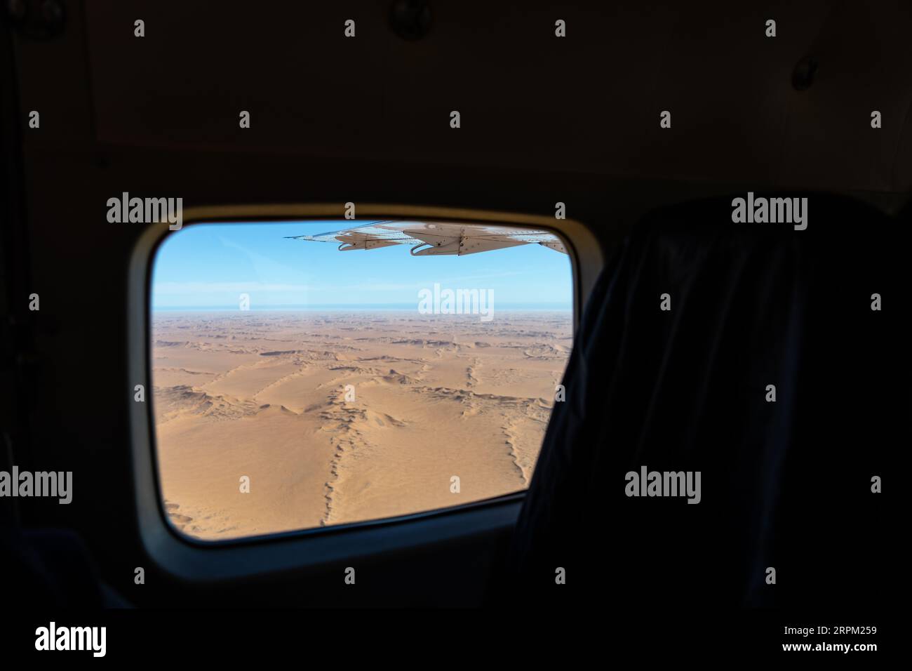 Aerial photograph from an airplane window of the dunes of the Namib ...