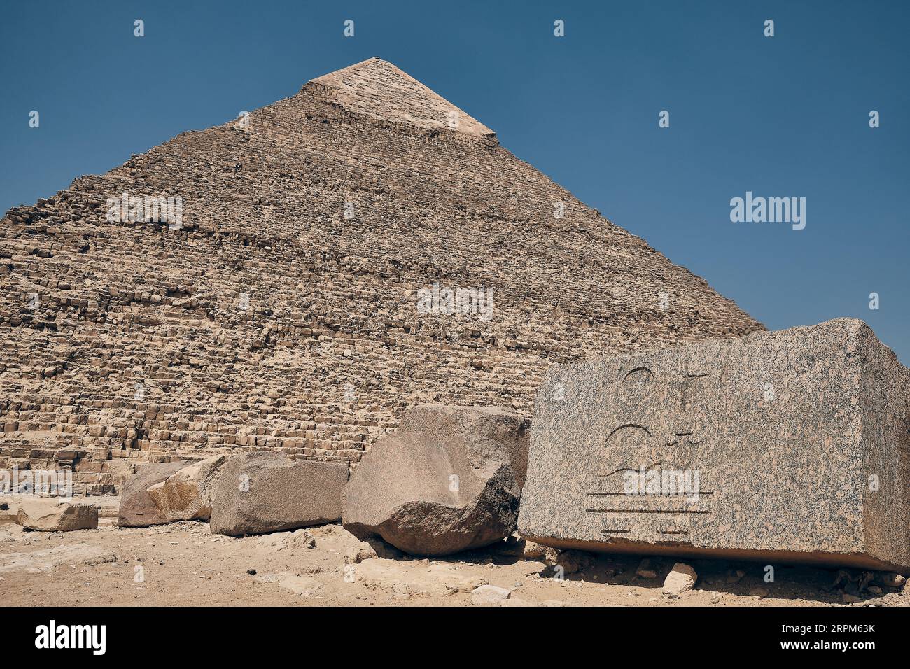Low angle view of Pyramid of Khafre and ancient Egyptian hieroglyphs ...