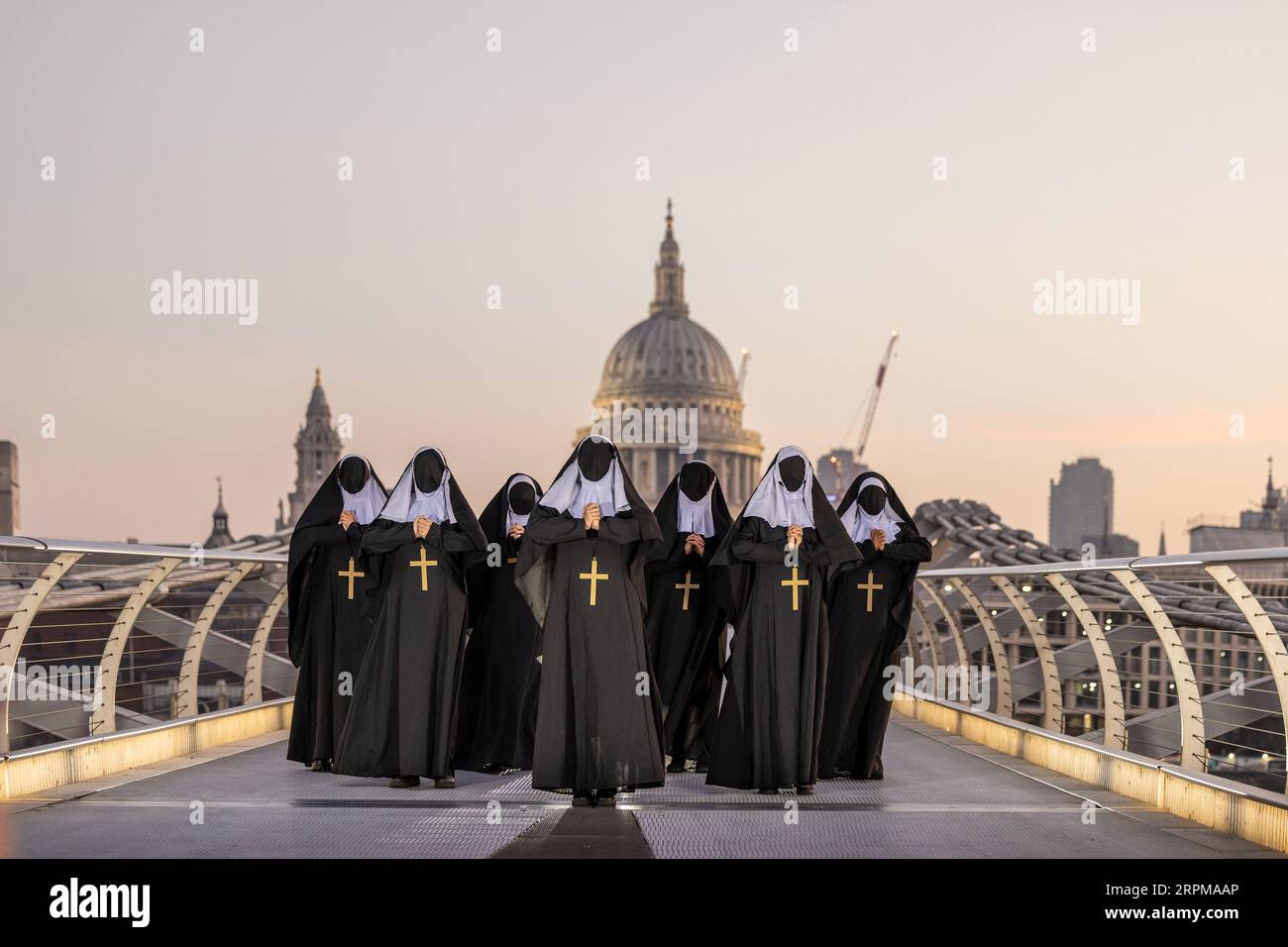 Seven demonic nuns descend on London's Millennium Bridge to celebrate ...