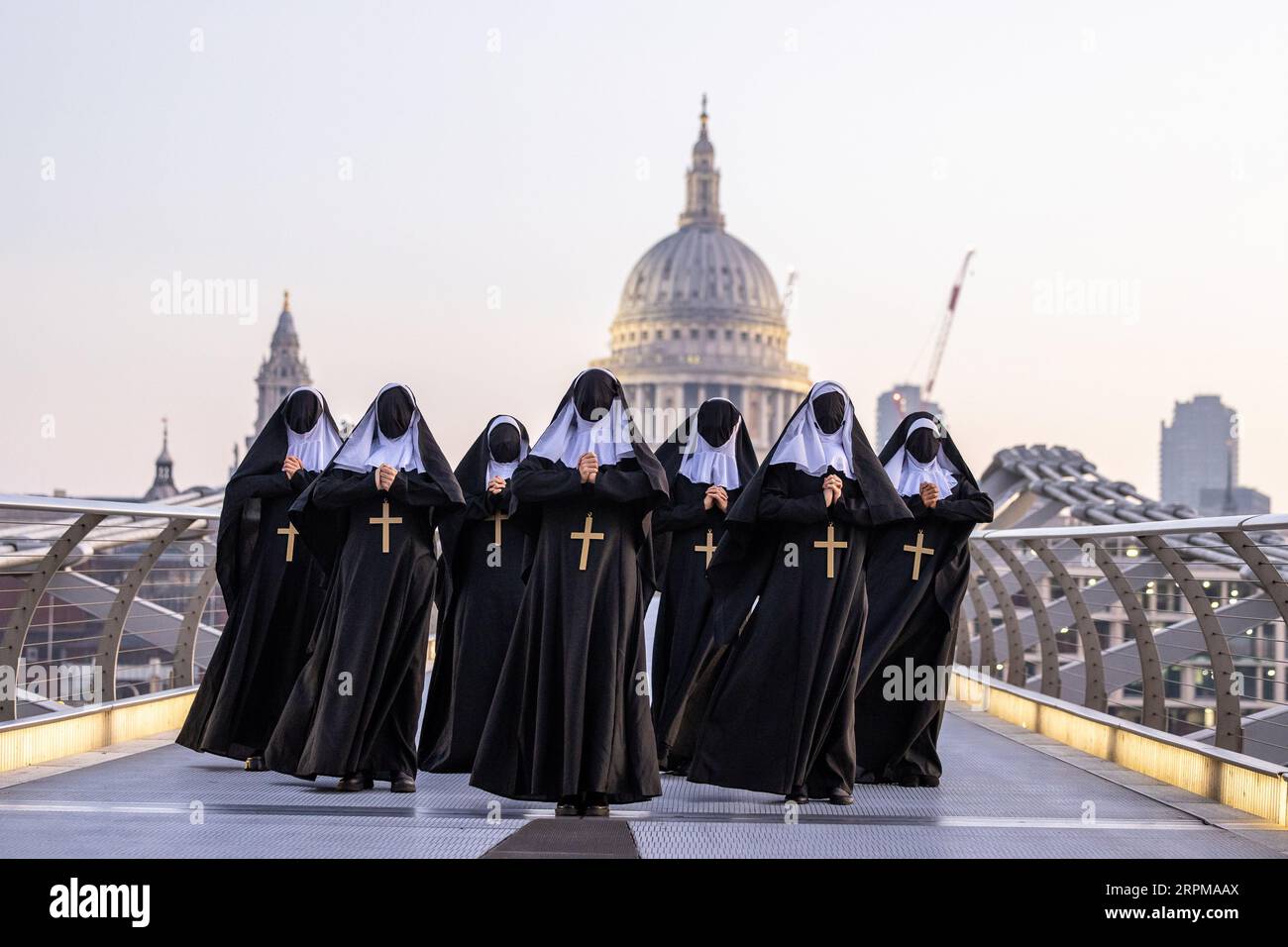 Seven demonic nuns descend on London's Millennium Bridge to celebrate ...