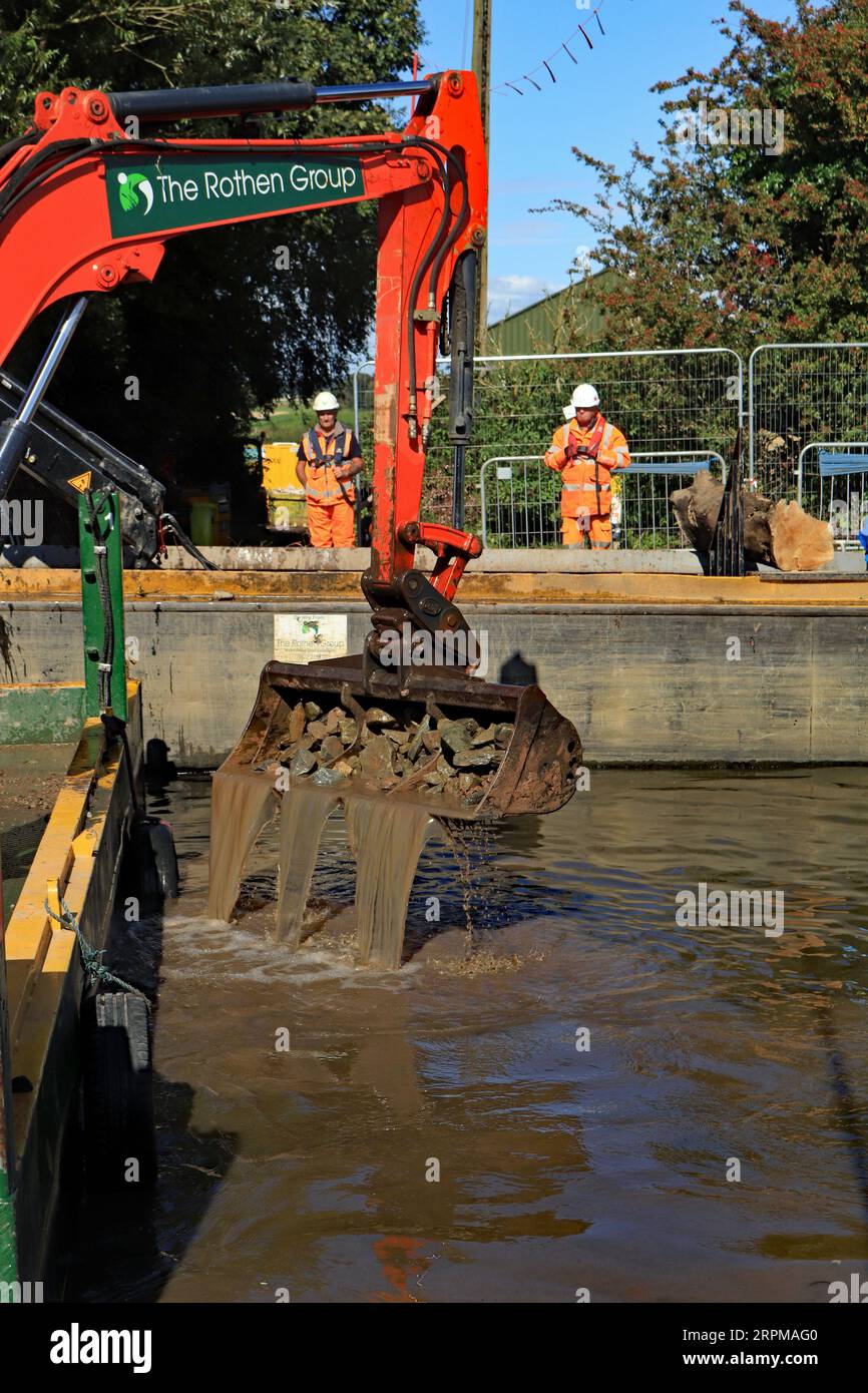 Water flowing from an excavator bucket hi-res stock photography and ...