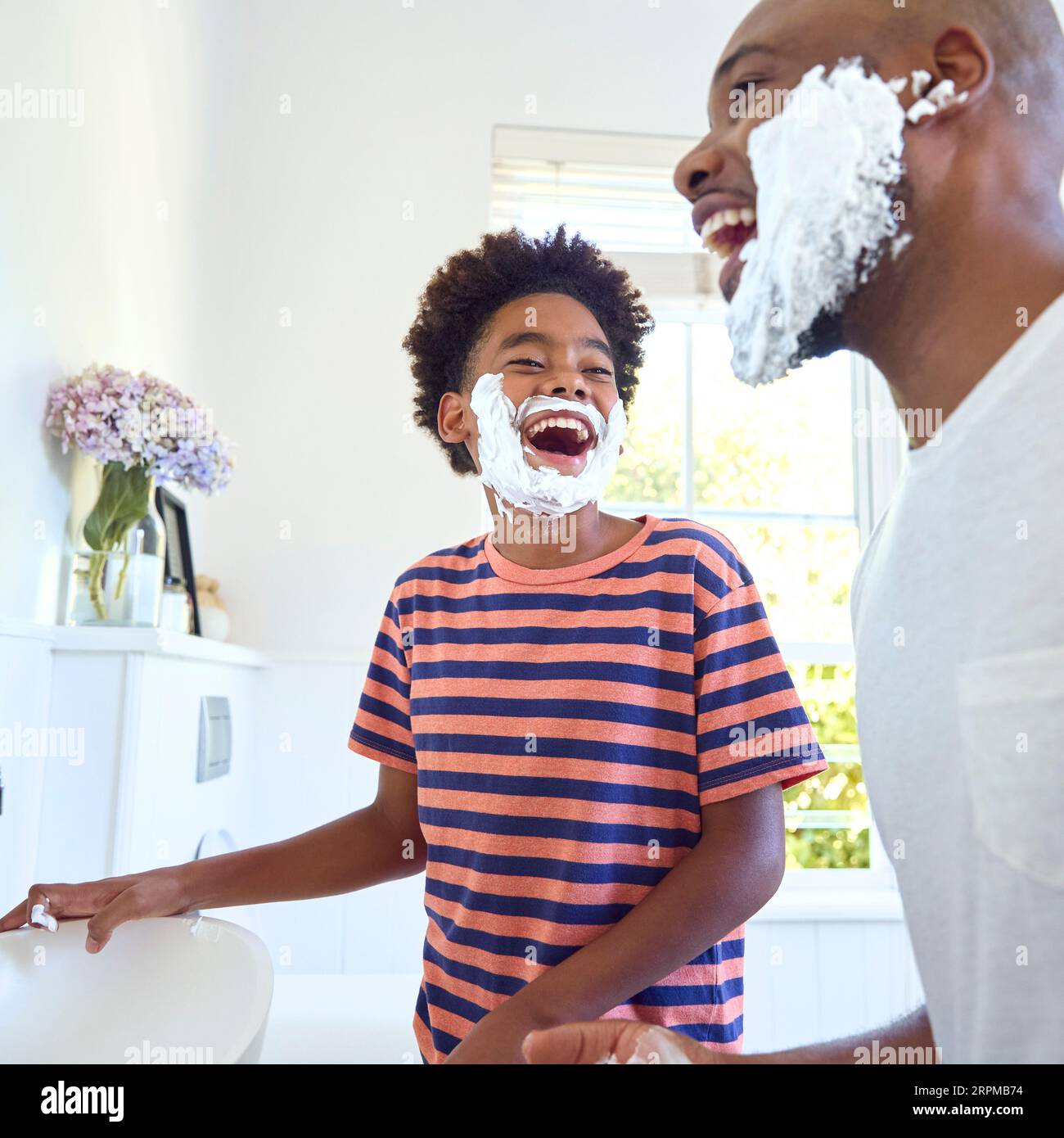 Father And Son At Home Having Fun Playing With Shaving Foam In Bathroom ...