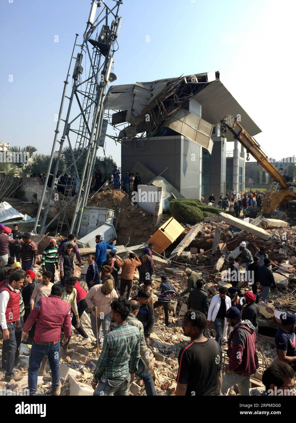 200209 -- NEW DELHI, Feb. 9, 2020 -- Rescuers and locals gather at the ...