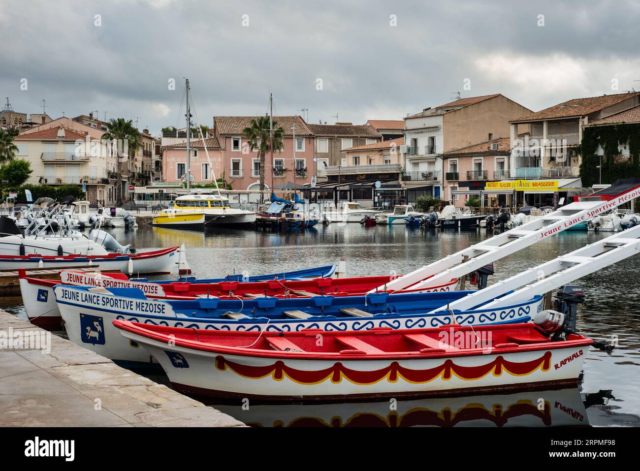 Boats used for jousting during summer festival, Port of Meze, Herault ...