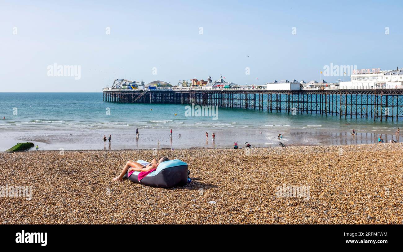 Brighton UK 5th September 2023 - Visitors on Brighton beach early this ...
