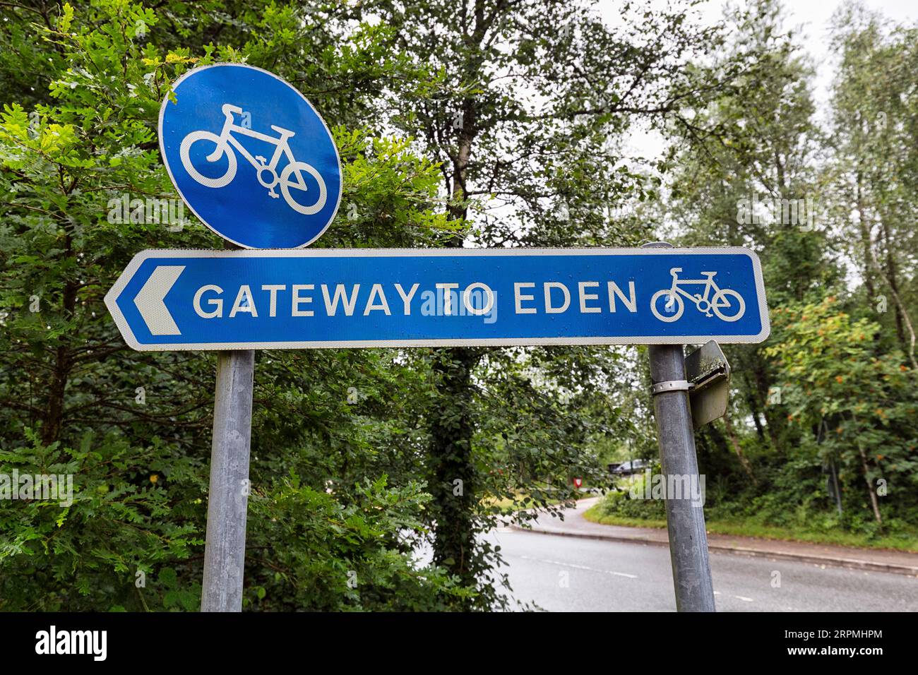 Blue traffic sign in the rain, cycle path, original signpost with ...