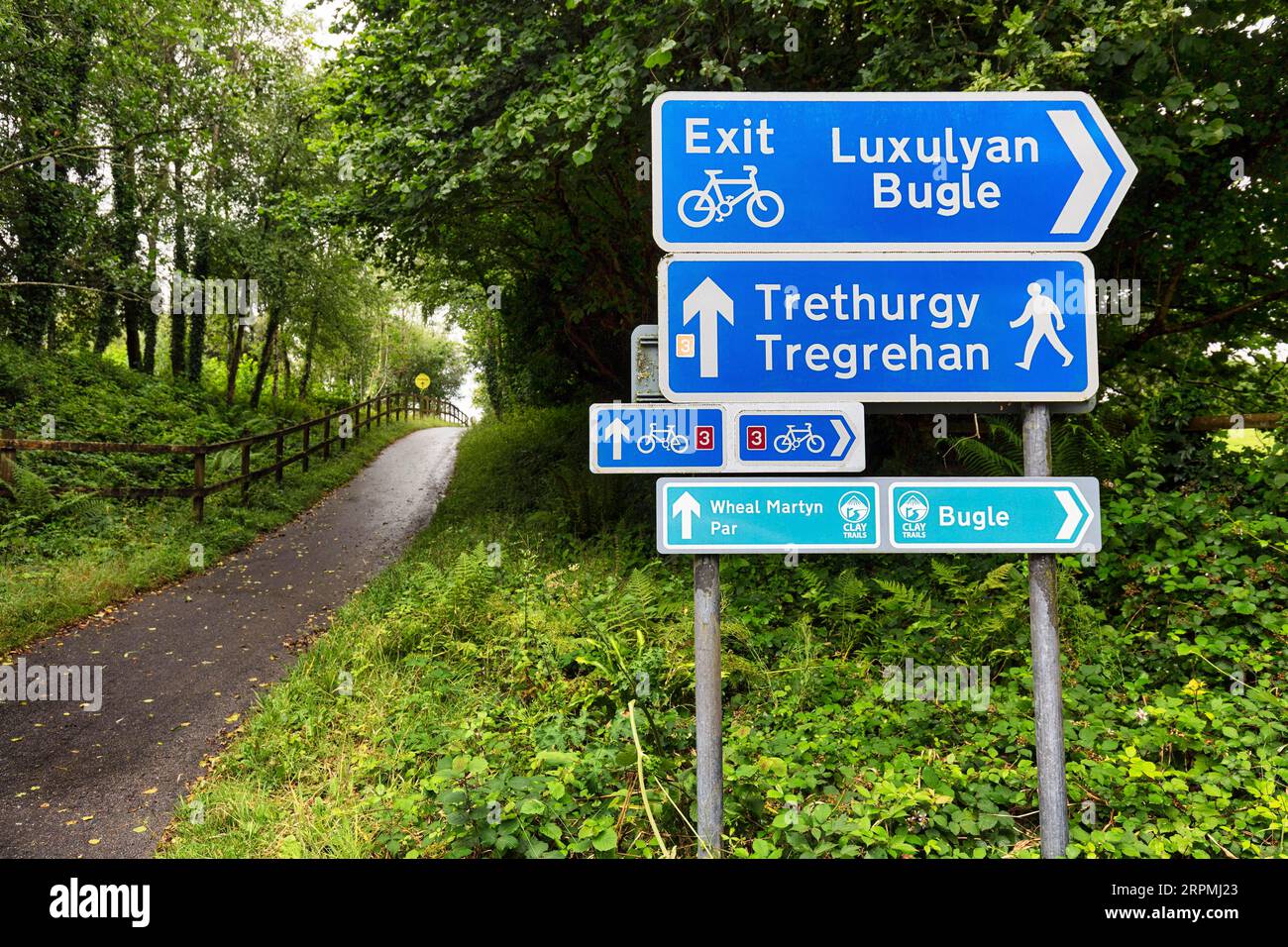 Blue road signs, cycle route in the rain, National Cycle Route 3, long ...