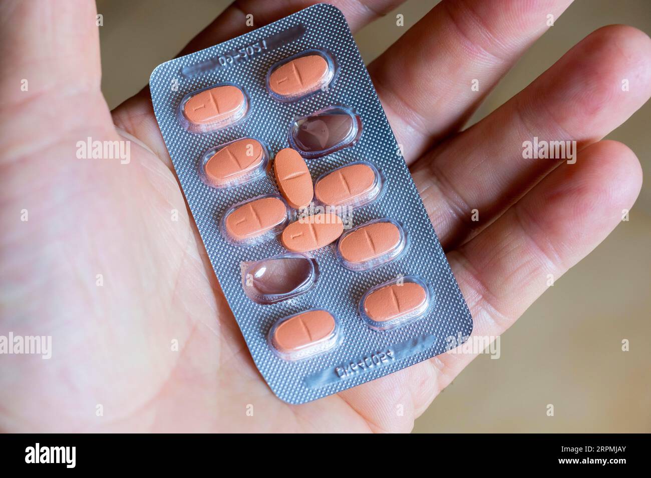Packet of pills with hand hi-res stock photography and images - Alamy