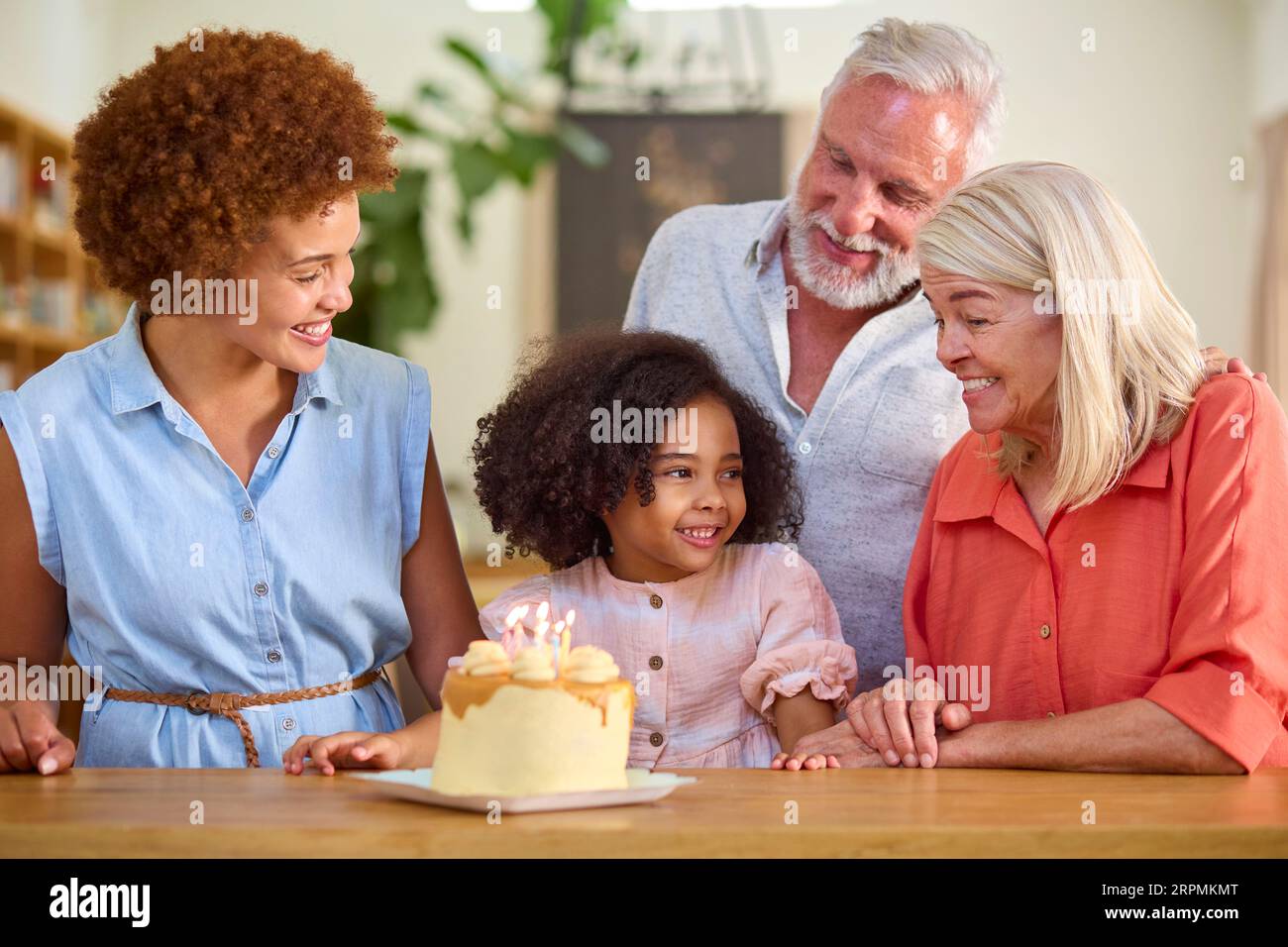 Multi-Generation Family Celebrating Granddaughter's Birthday At Home ...