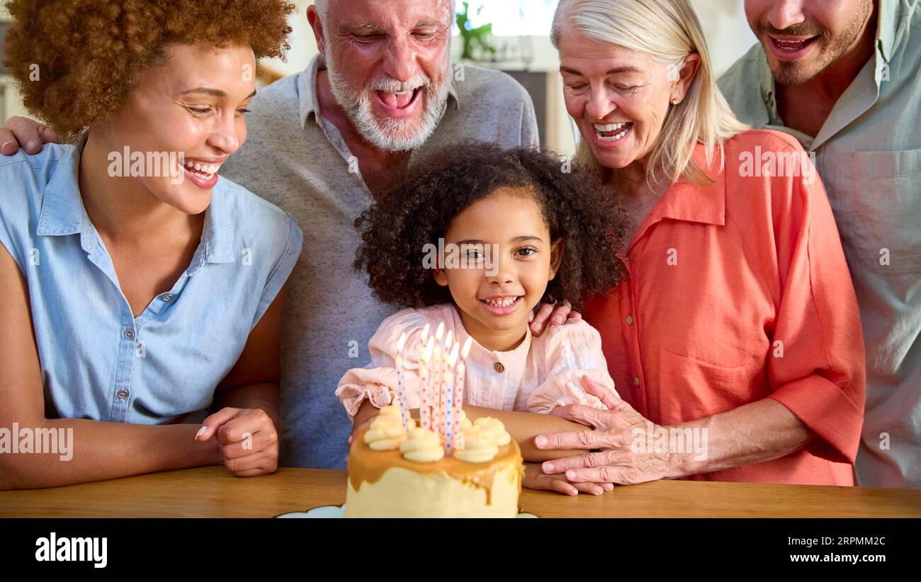Multi-Generation Family Celebrating Granddaughter's Birthday At Home ...