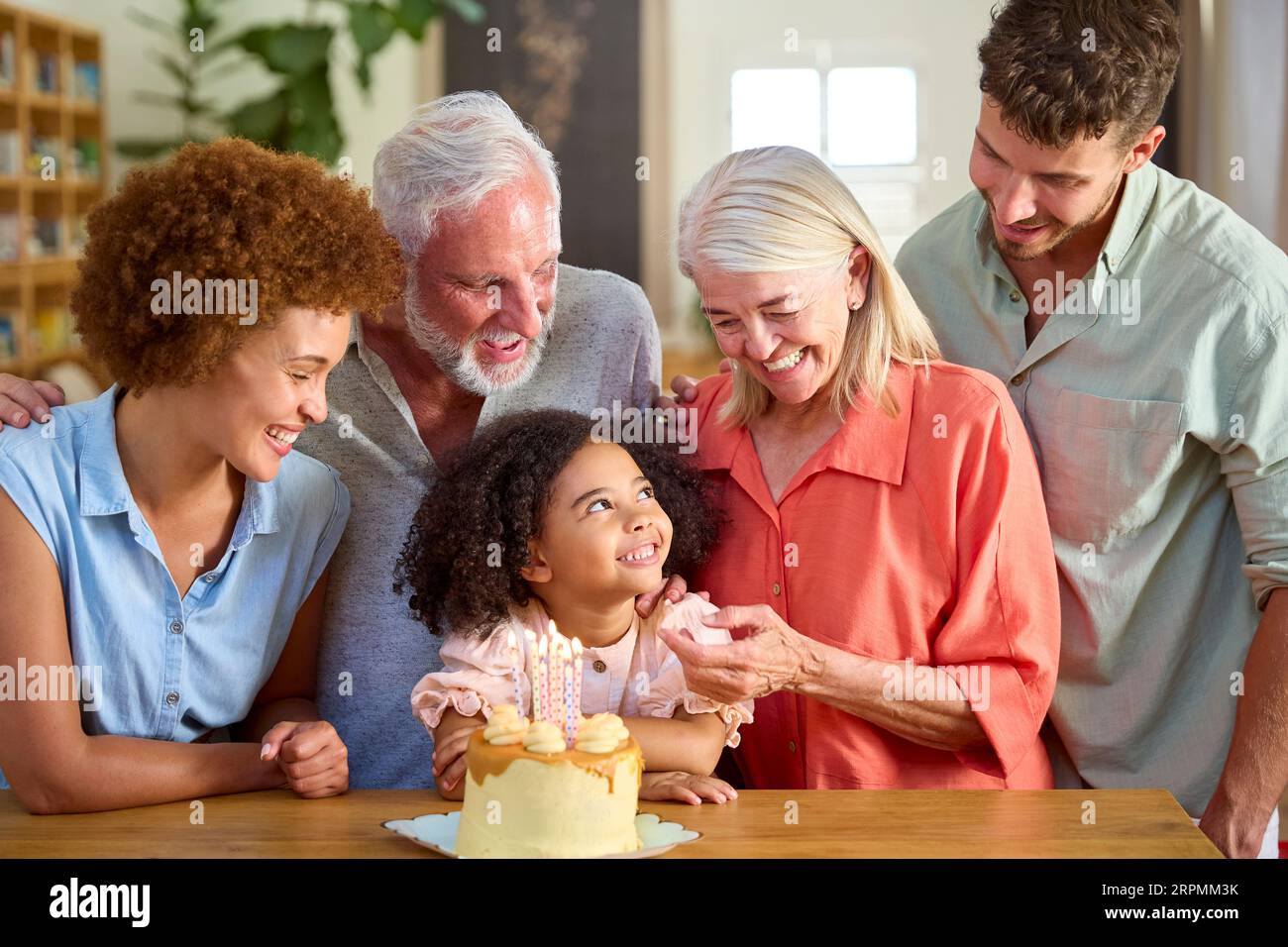 Multi-Generation Family Celebrating Granddaughter's Birthday At Home ...