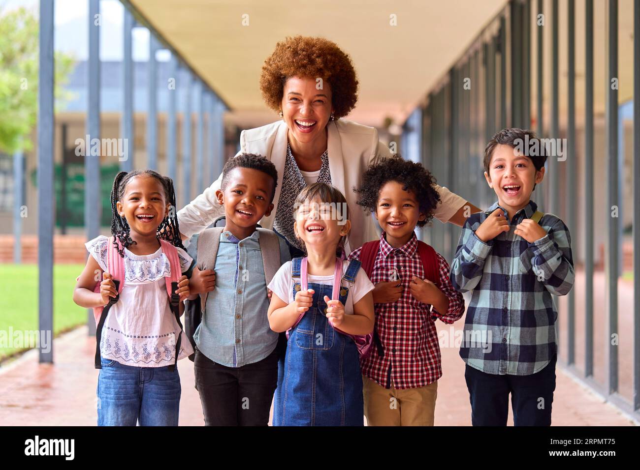 Portrait Of Multi-Cultural Elementary School Pupils With Female Teacher ...