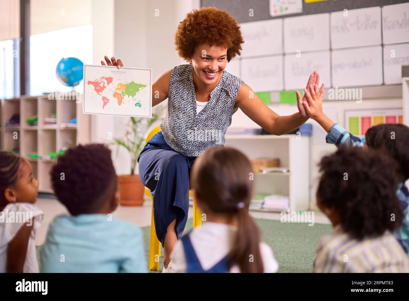 Multi-Cultural Elementary School Pupils With Female Teacher In ...
