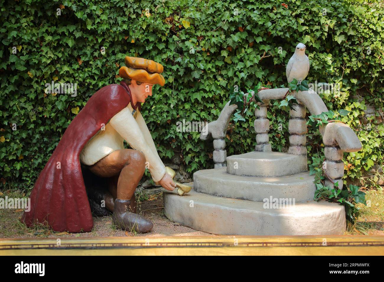 Sculpture Prince with golden shoe to the fairy tale Cinderella ...