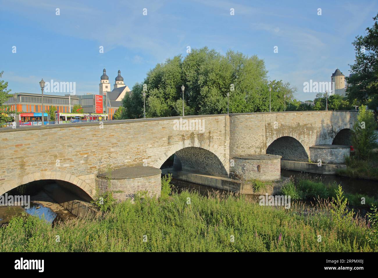 Historic Old Elster Bridge with church towers of the over the White ...