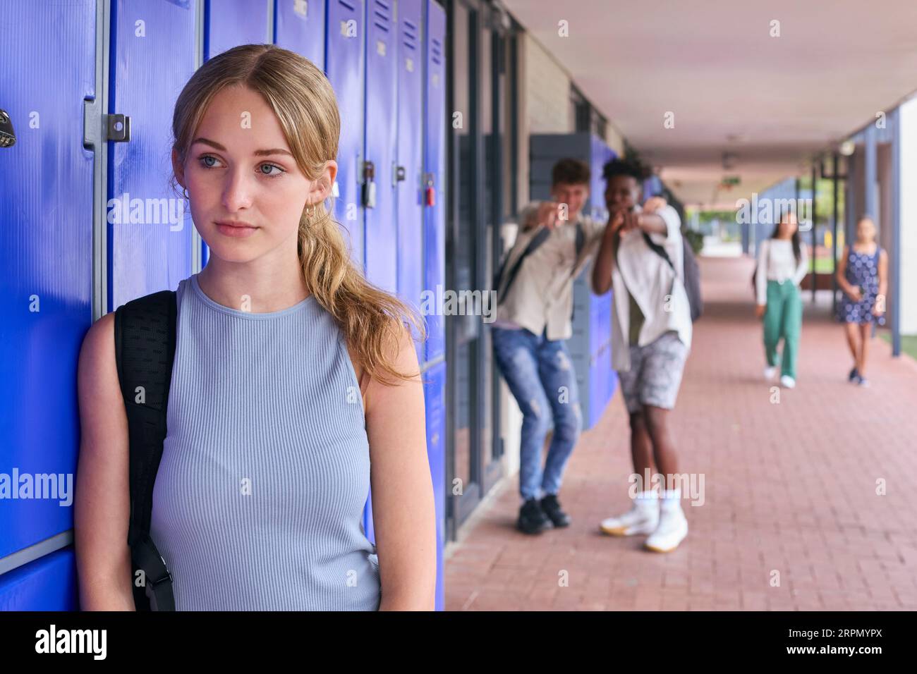 Unhappy Teenage Girl Outdoors At High School Being Teased Or Bullied ...