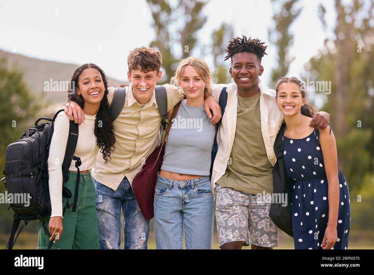 Portrait Of Multi-Cultural Secondary Or High School Students Hugging ...