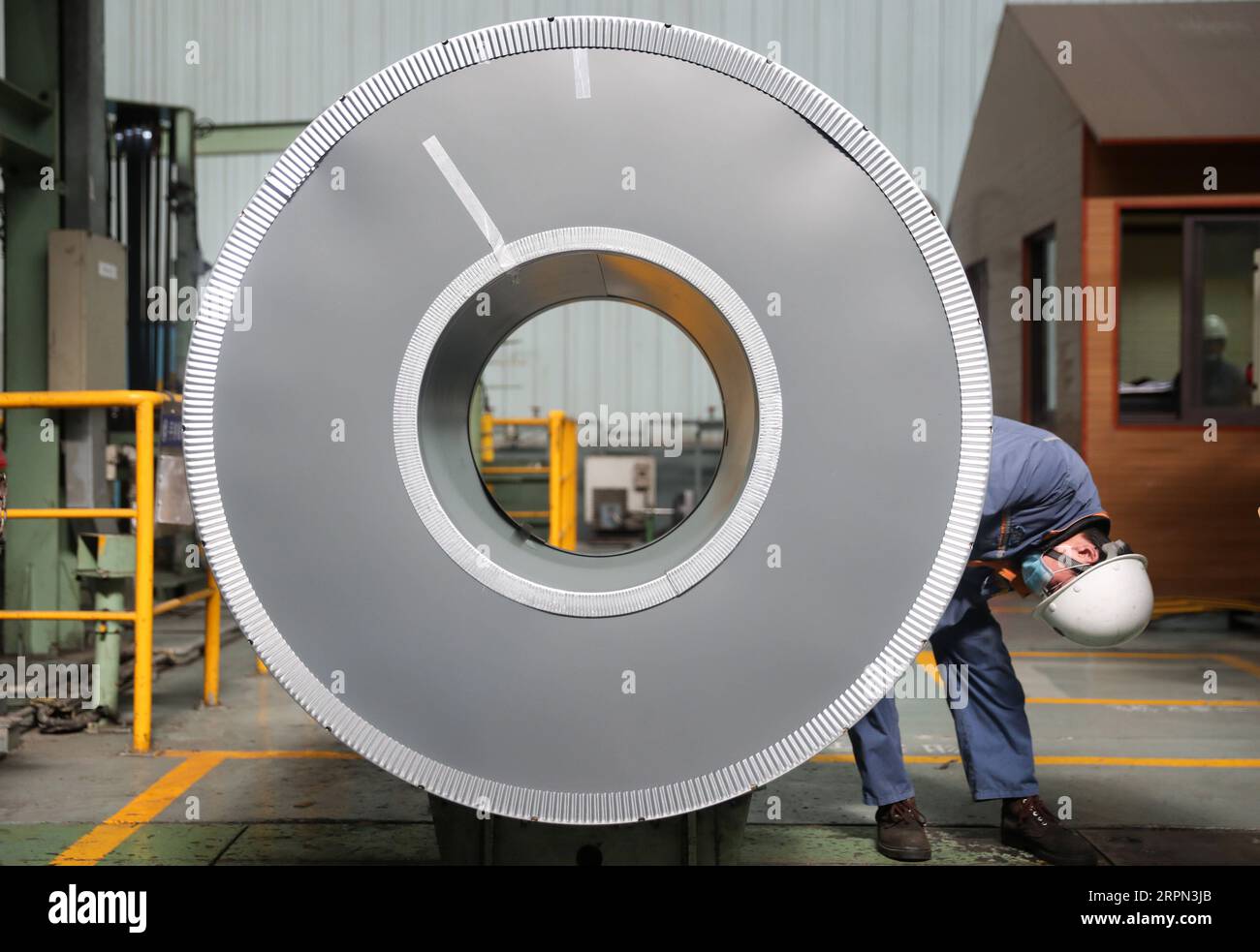 200221 -- SHANGHAI, Feb. 21, 2020 -- A worker works at a workshop of a ...