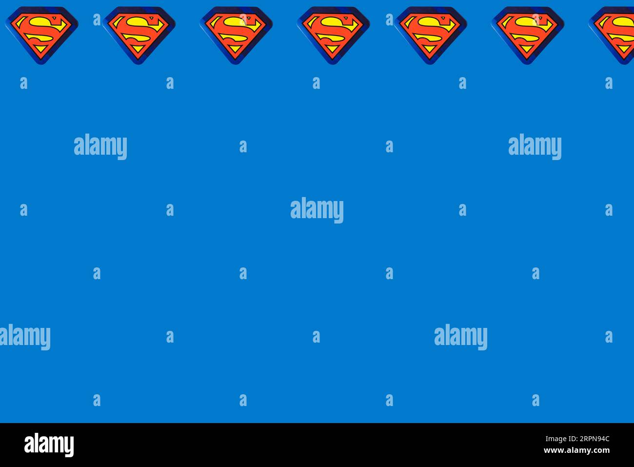 Pattern of DC comics Superman superhero logos, on top, on blue ...