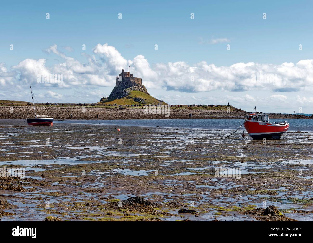 View towards Lindisfarne Castle standing on its rocky crag seen across ...